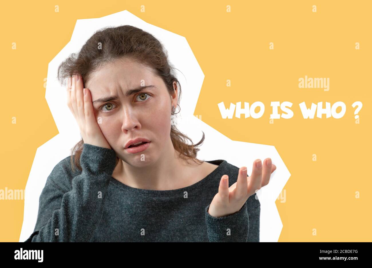 A young woman holding her head, she is troubled by problems. Orange ...