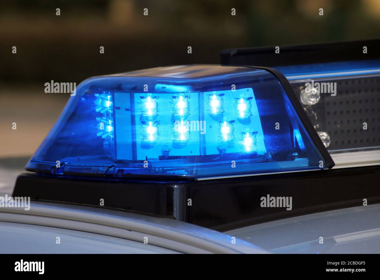 Symbol image police operation: Close up of a blue light on a police car ...