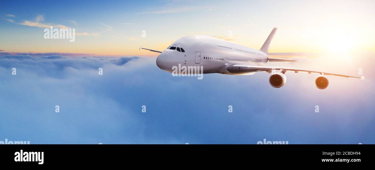 Huge two-storey passengers commercial airplane flying above clouds in ...