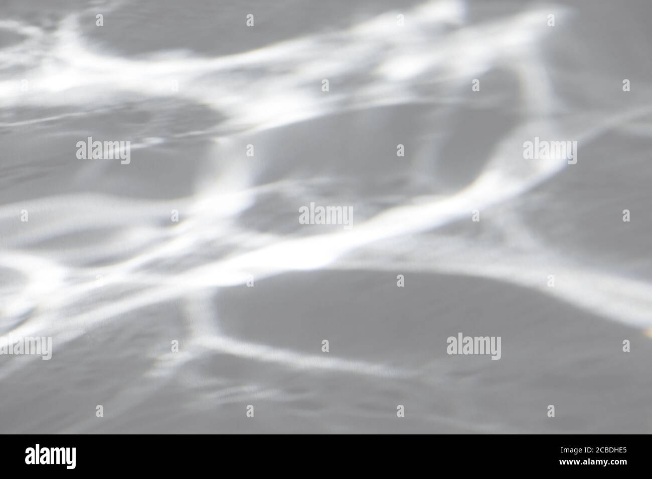 shadow and light caustic effect on a white wall Stock Photo - Alamy