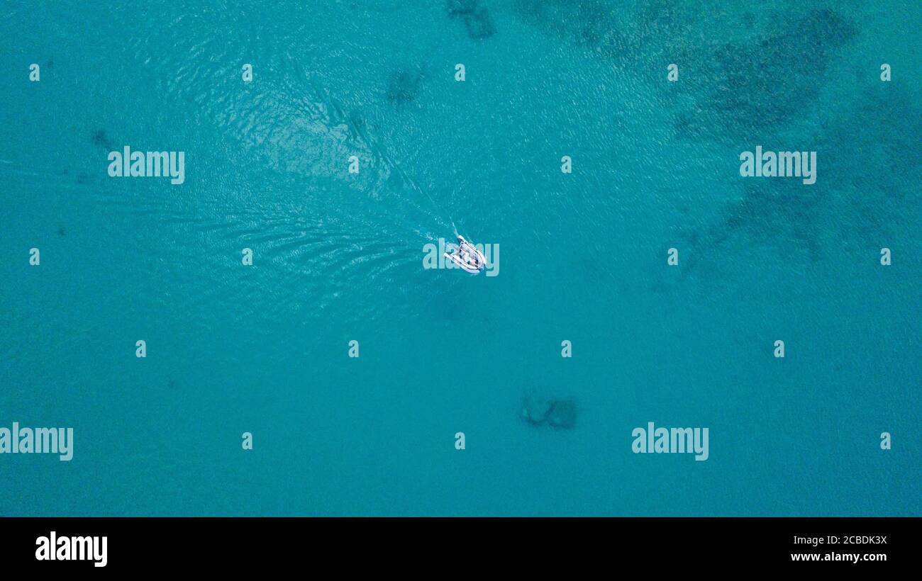 Aerial view of sculler in open water. Ocean and sea travel and ...