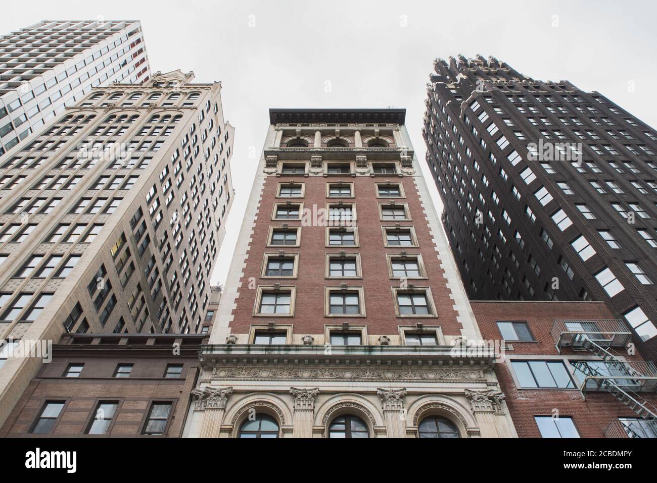 Low angle shot of tall brown buildings in New York City Stock Photo - Alamy