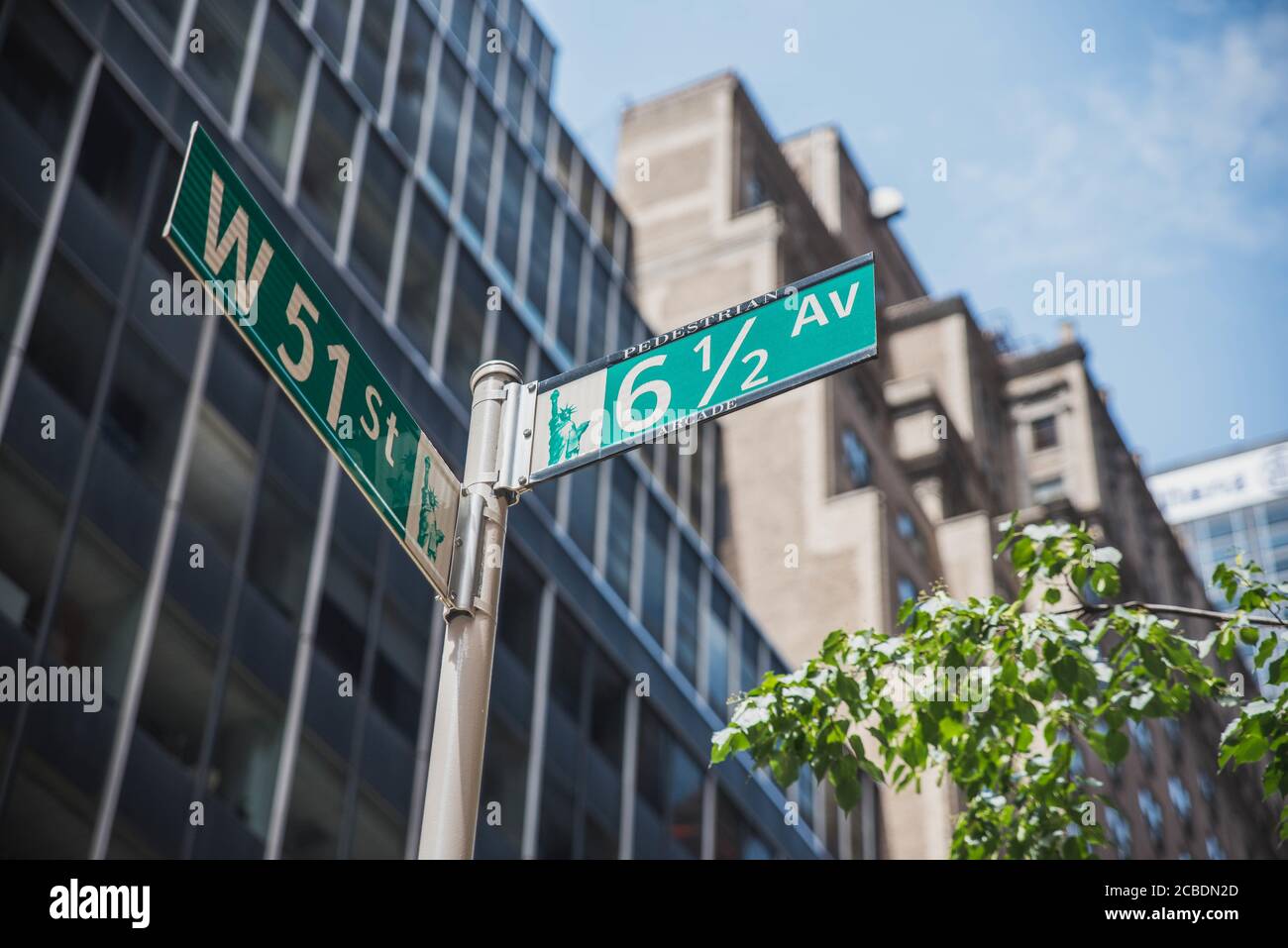 Low angle shot of greens street name signs at an intersection in New ...