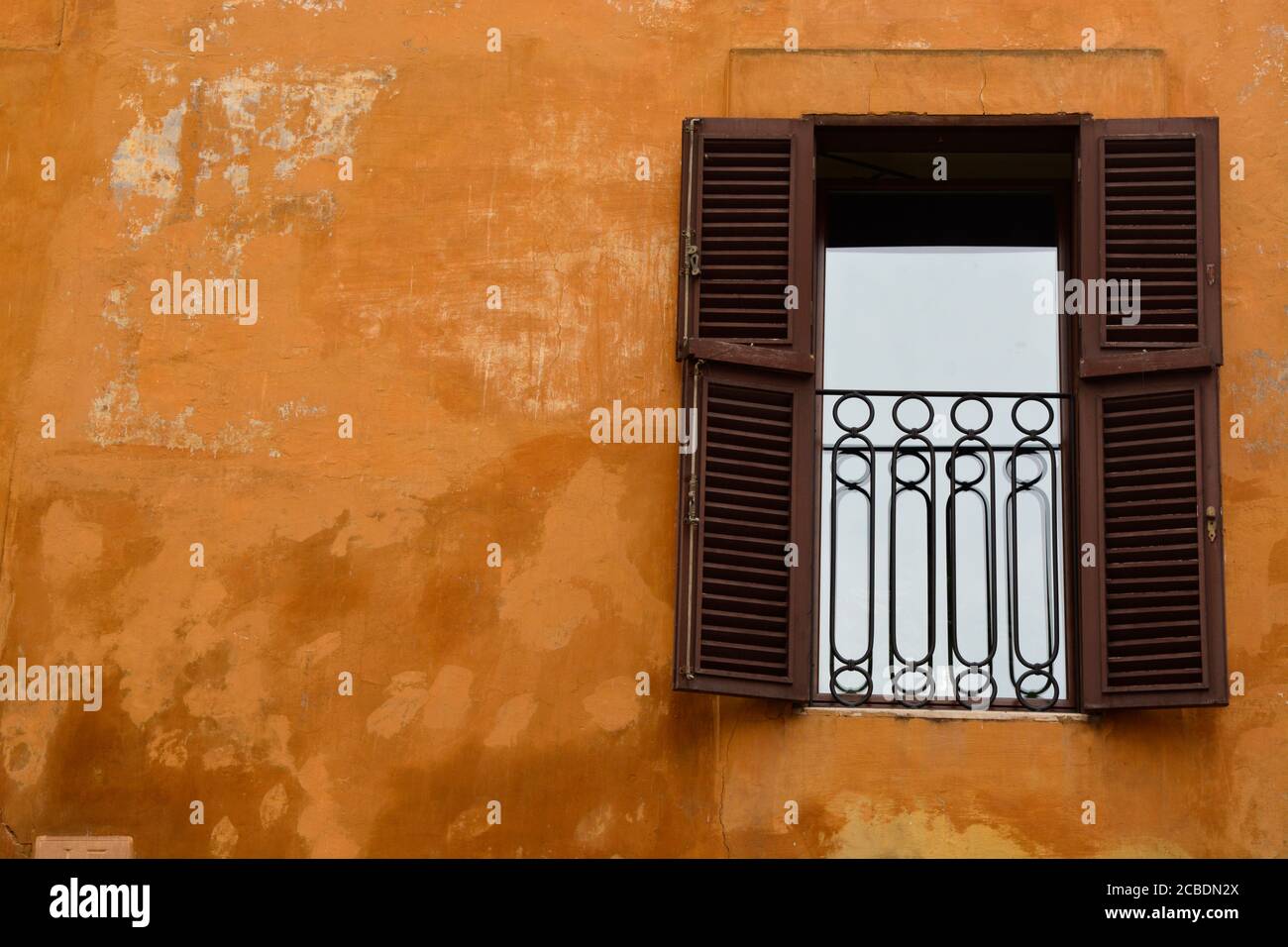 A Vintage Window with Rustic Orange Wall Stock Photo - Alamy