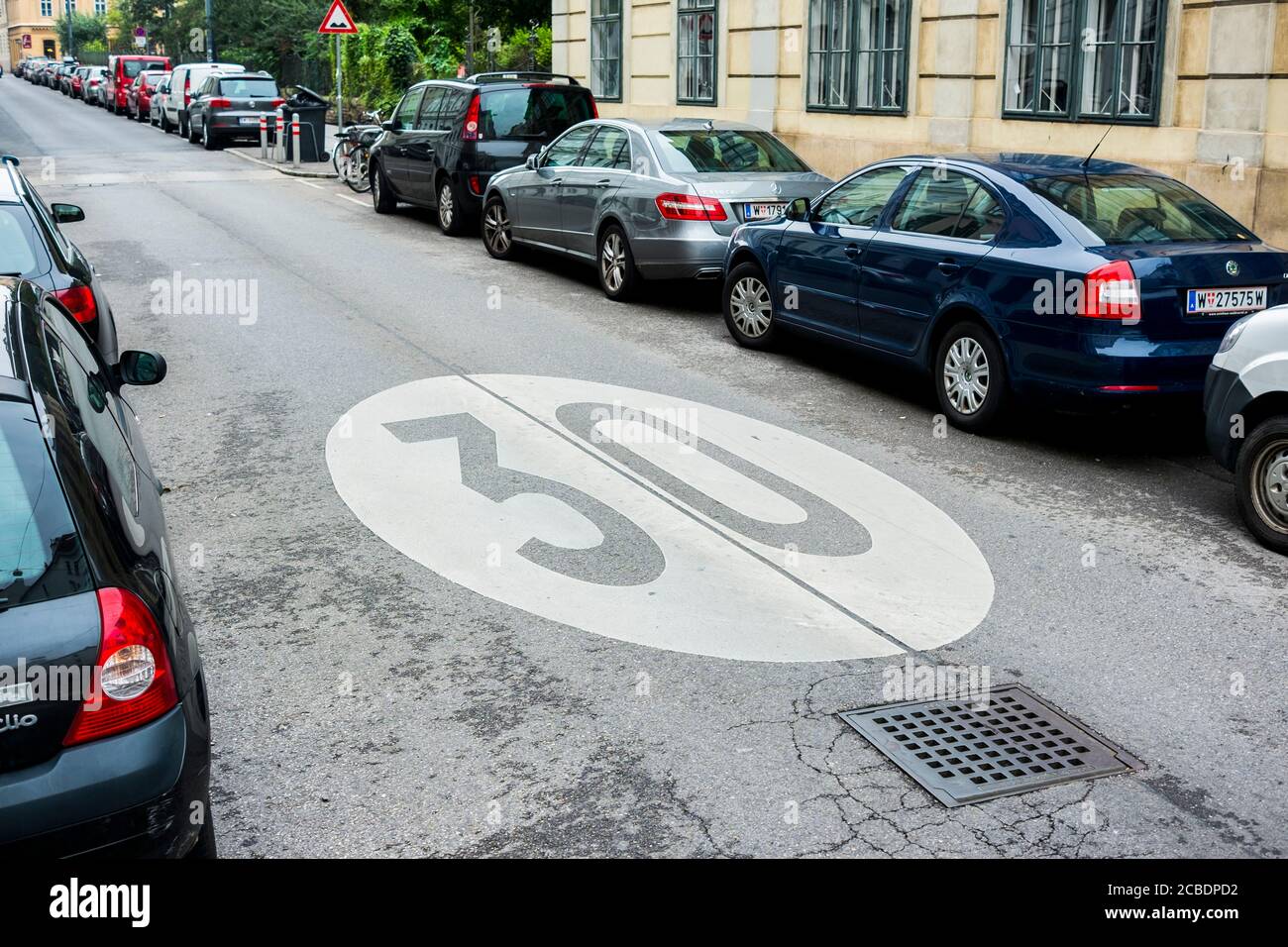 The standard, typical, iconic painted circular 30kph speed limit sign ...