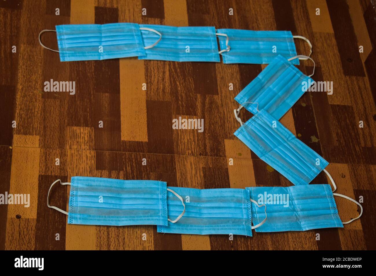 Several masks are used to form a letter M from them which means masks ...