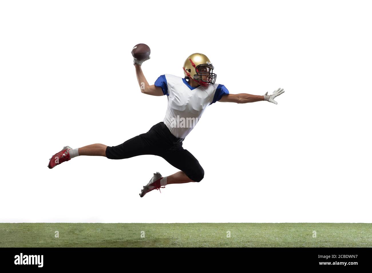 In jump, flight. American football player isolated on white studio ...