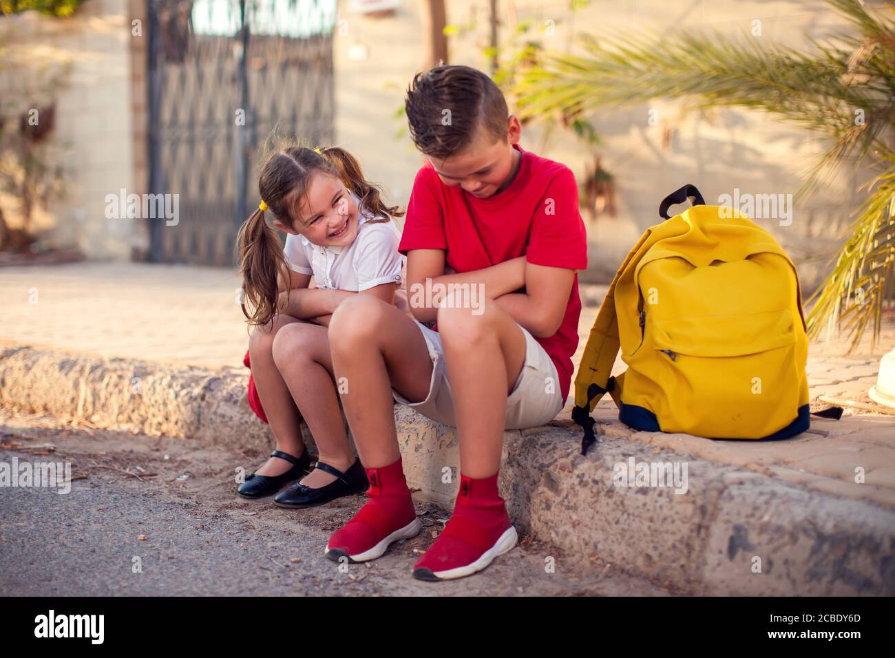 Upset pupils taking offense to each other outdoor. Children and ...