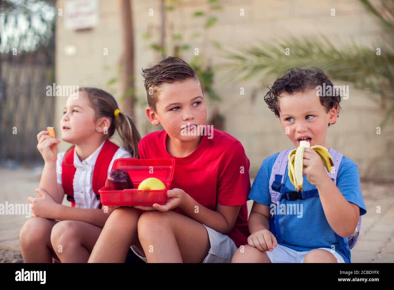 Pupils having a snack outdoor. Children, education and nutrition ...
