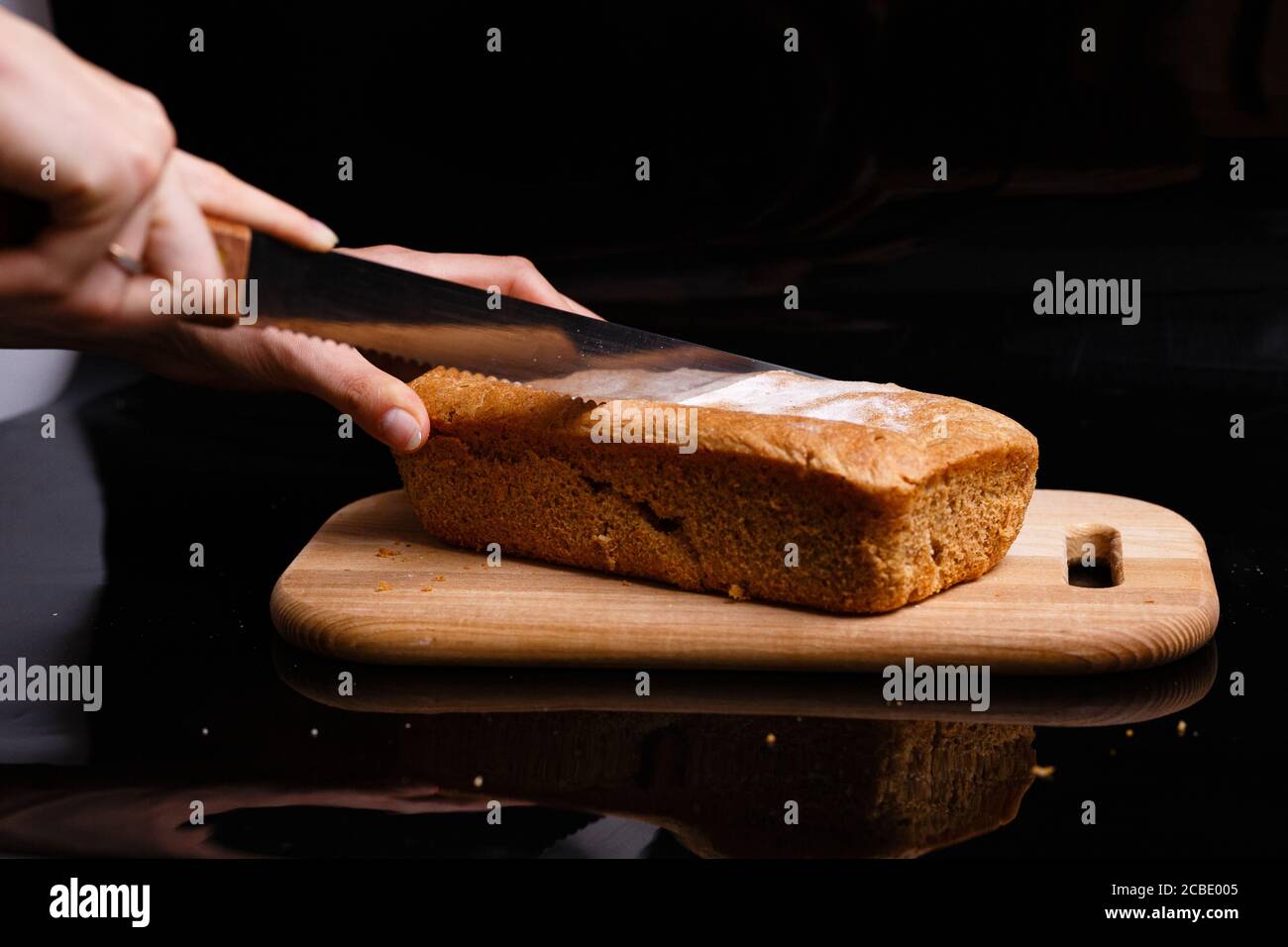 Homemade gray bread on a black background. Photo in section Stock Photo ...