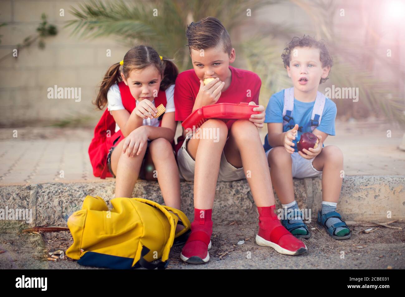 Pupils having a snack outdoor. Children, education and nutrition ...