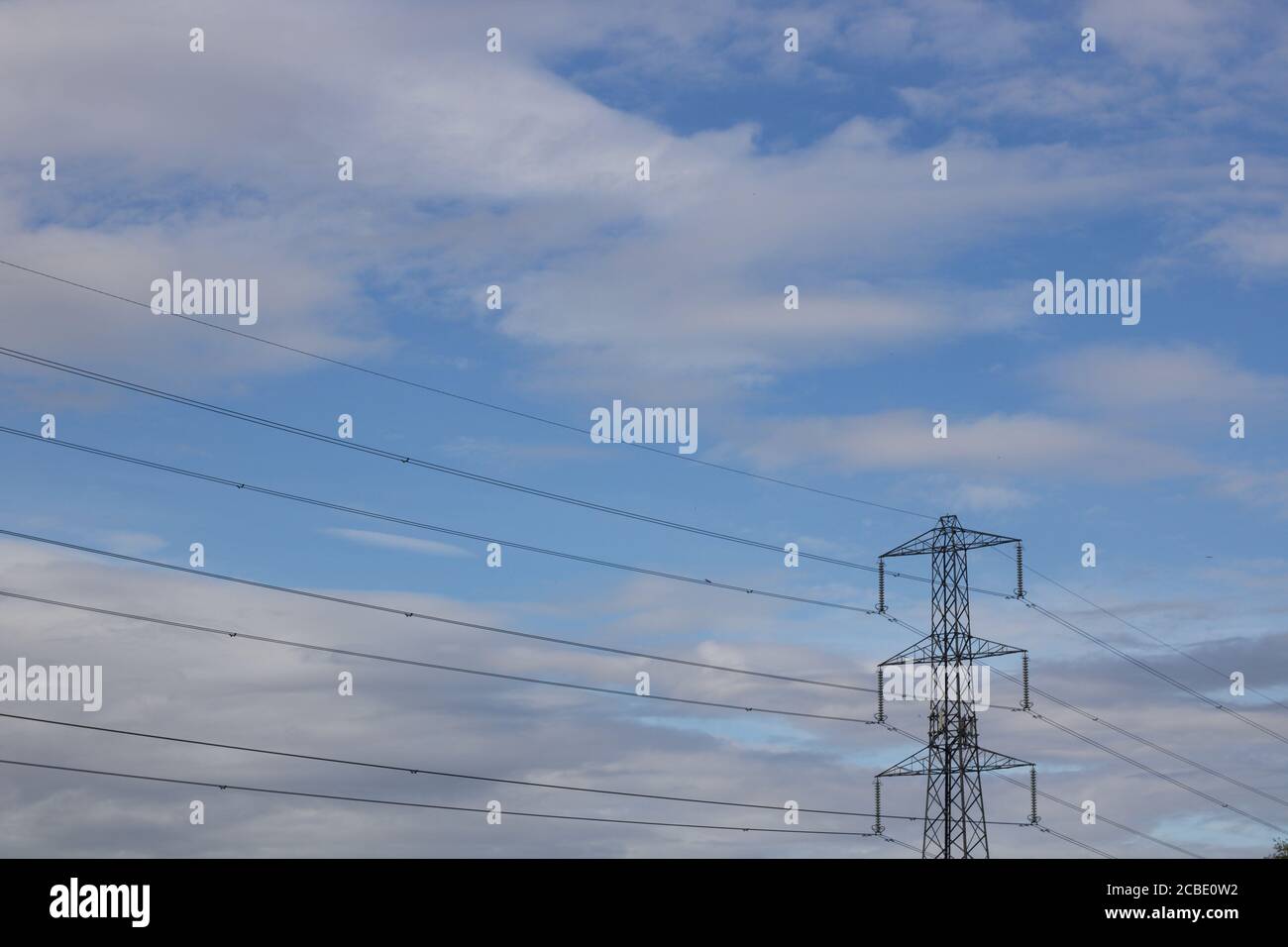 Simple image of pylon against blue cloudy sky with copy space Stock ...