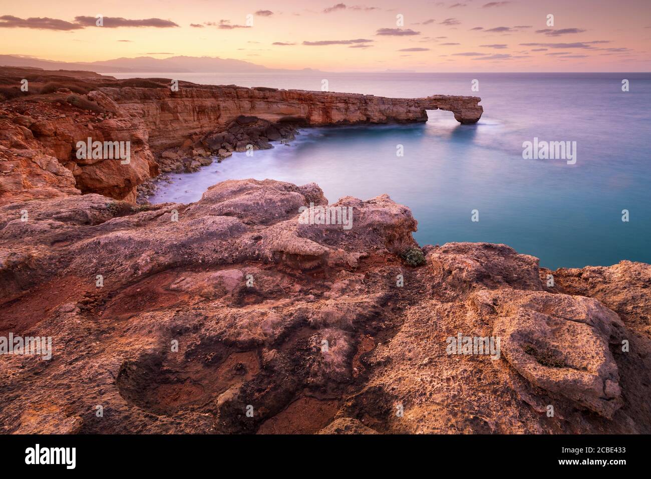 Limestone cliffs and a rock arch near Lavris village in Rethymno region ...