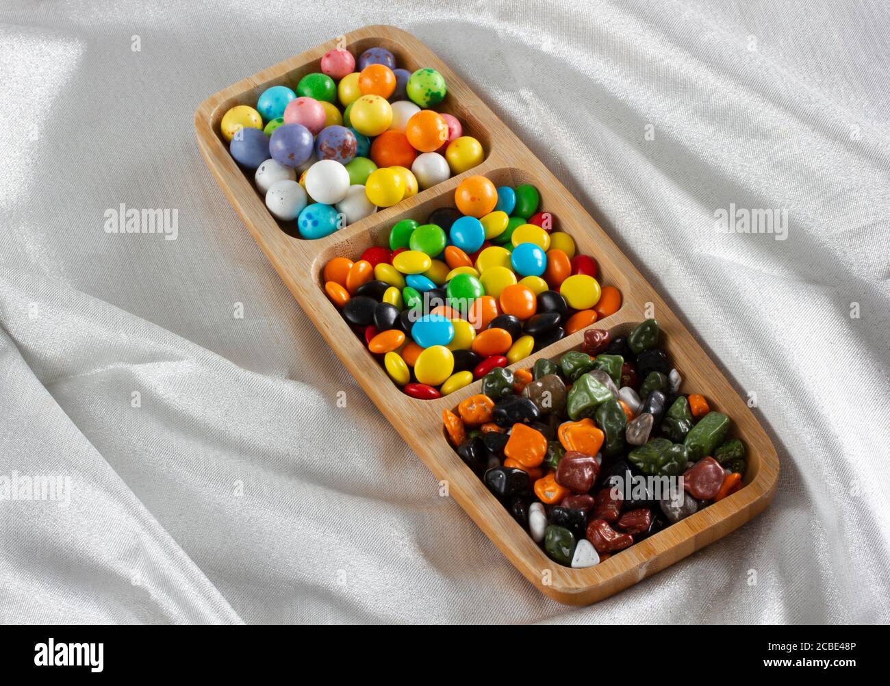 multicolor sugar coated chocolates background Stock Photo - Alamy