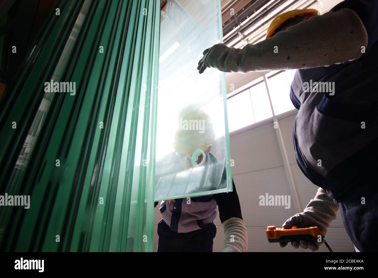 Glass manufacturing factory. Workers in the factory Stock Photo - Alamy
