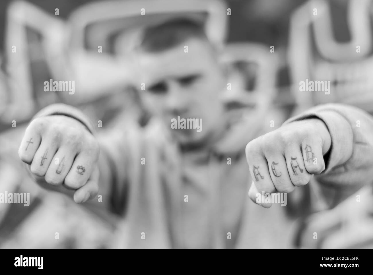 ACAB tattoo on the arm of a bully man. Black and white photo Stock ...