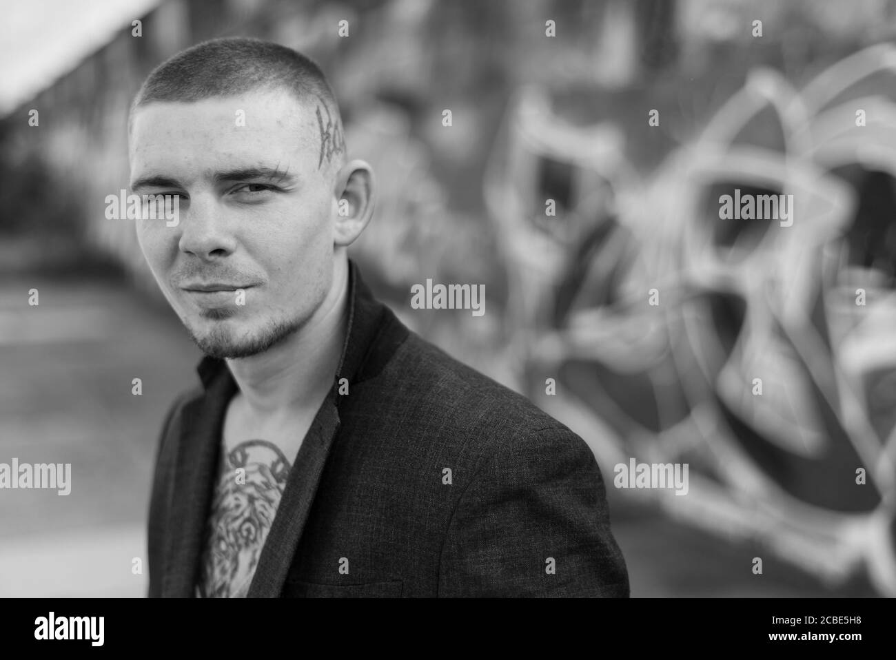 Portrait of a bully man in a jacket. Black and white photo Stock Photo ...