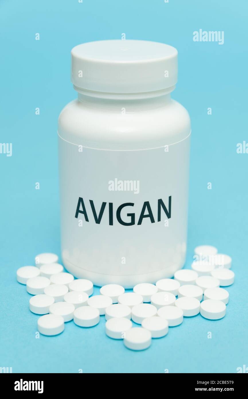 AVIGAN (Favipiravir) in white bottle packaging with scattered pills ...