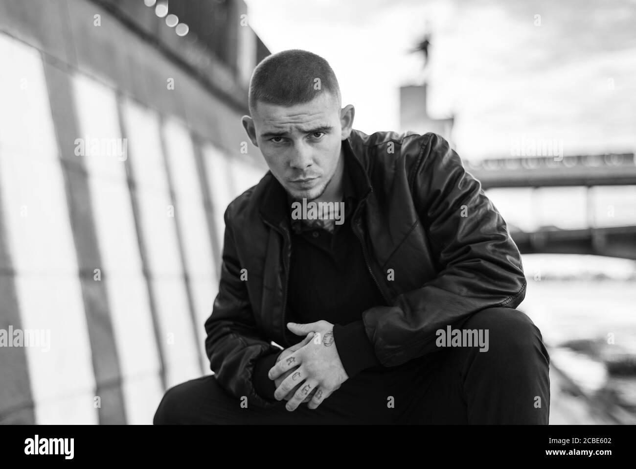 Bully criminal in black leather jacket. Black and white photo Stock ...