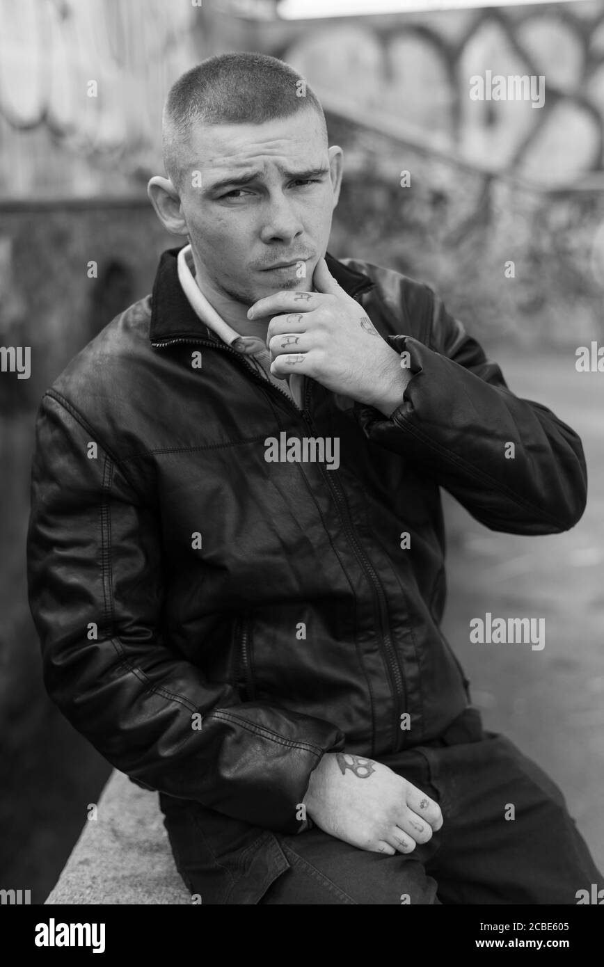 Bully criminal in black leather jacket. Black and white photo Stock ...