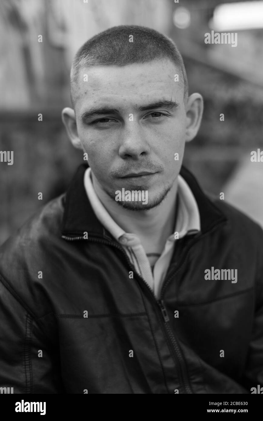 Bully criminal in black leather jacket. Black and white photo Stock ...