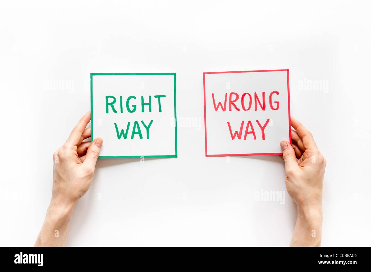Choice concept. Right and wrong way icons, female hands top view Stock ...