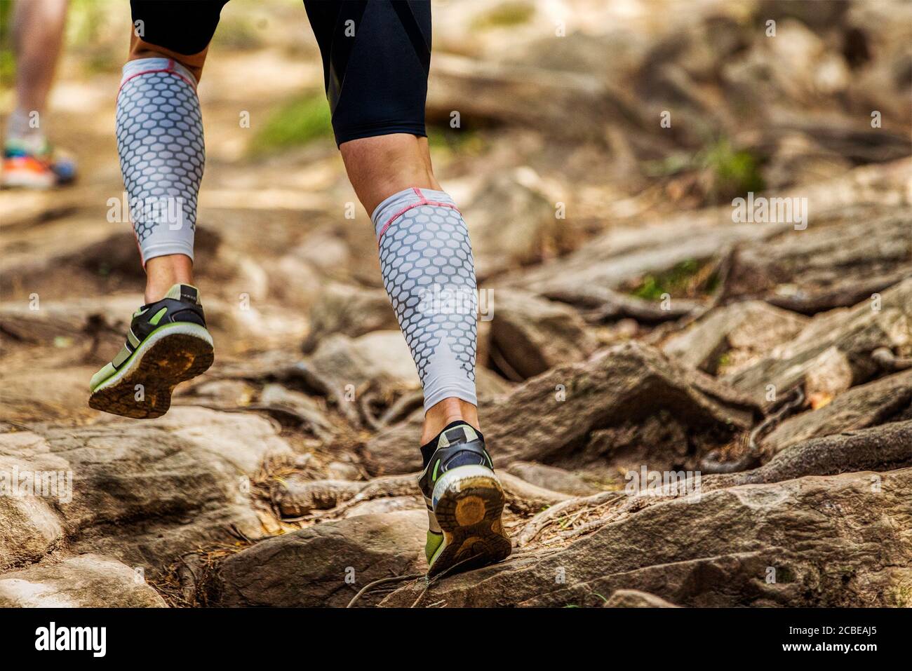 legs runner in compression sleeveless socks run stones trail race Stock ...