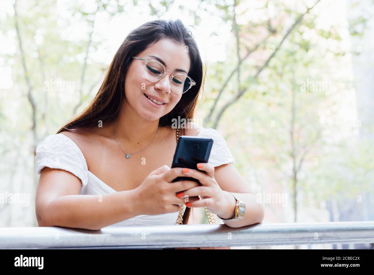 Woman send message on cellphone hi-res stock photography and images - Alamy