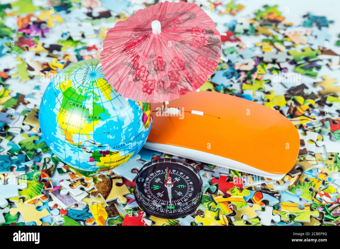 Compass Computer Mouse Earth globe umbrella travel concept Puzzle ...