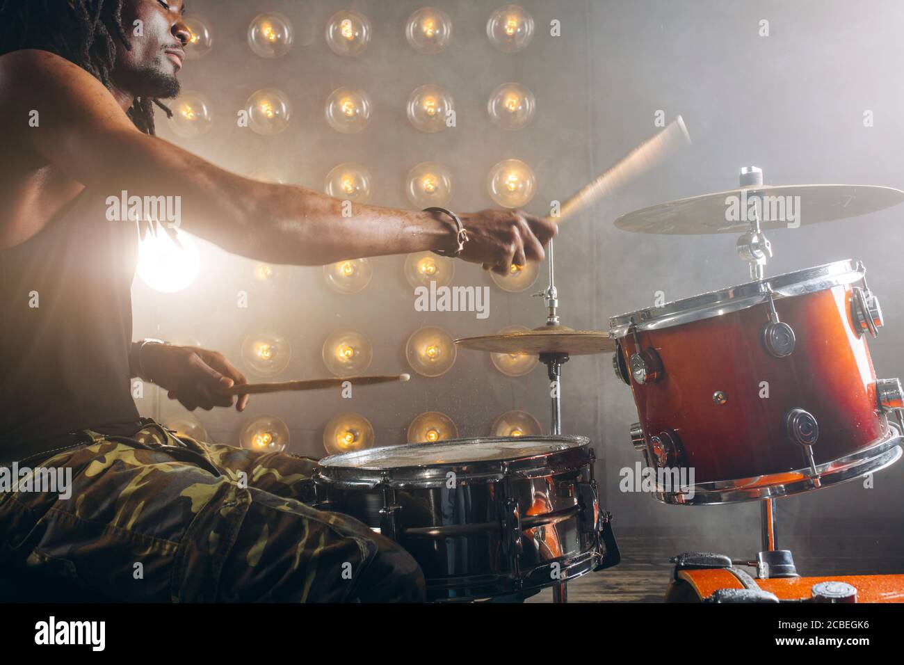 talented man playing drums on stage. close up side view photo. copy ...