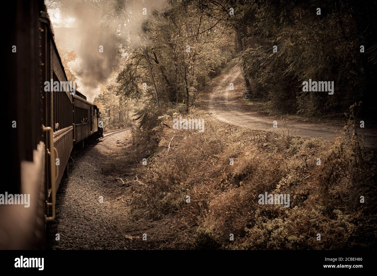 Old country road bends with the old railroad Stock Photo - Alamy