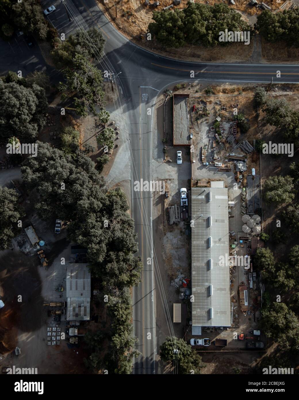 Aerial top view of roadway next to buildings Stock Photo - Alamy