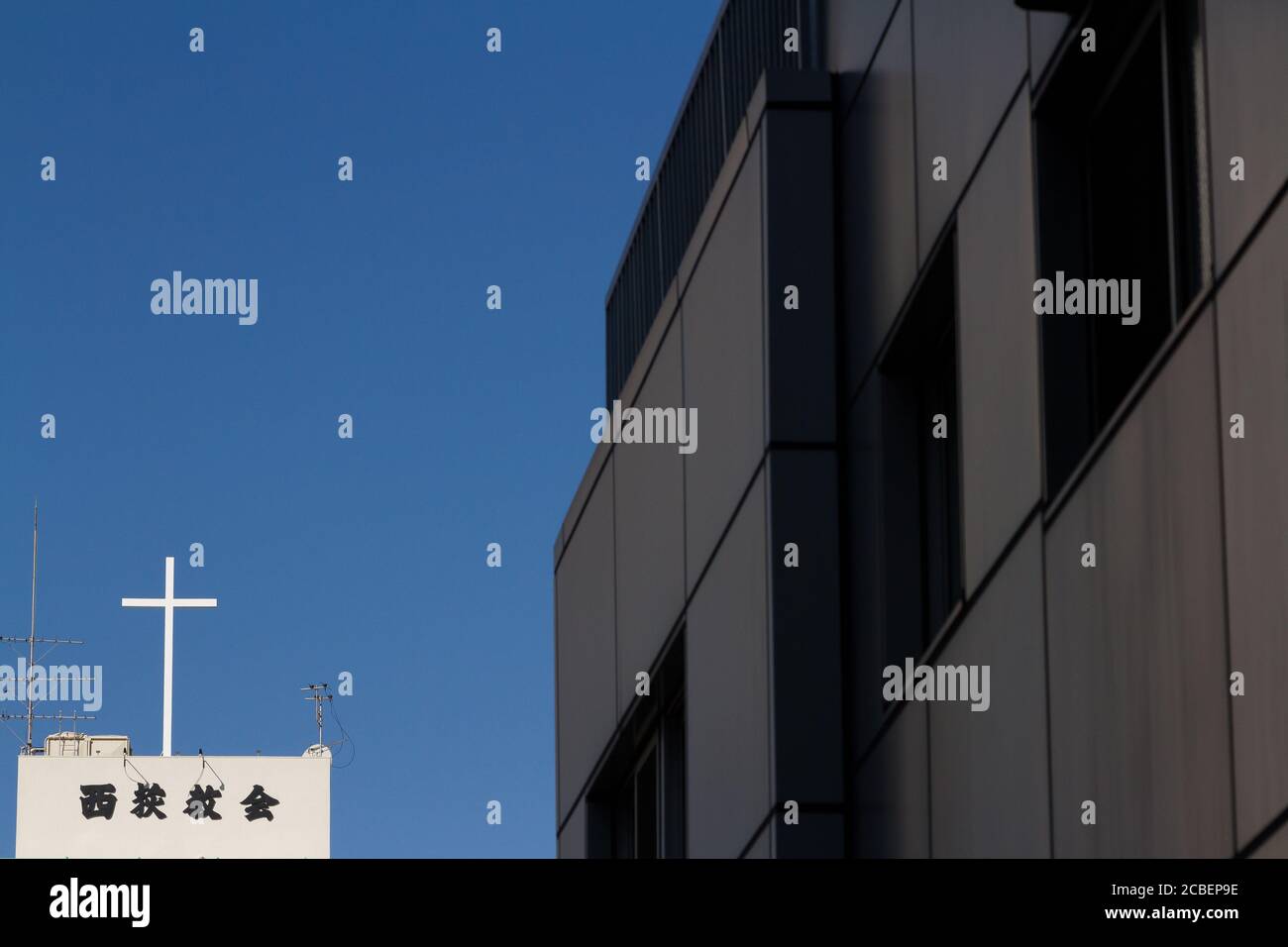 A Christian cross on top of a church in Tokyo, Japan Stock Photo - Alamy