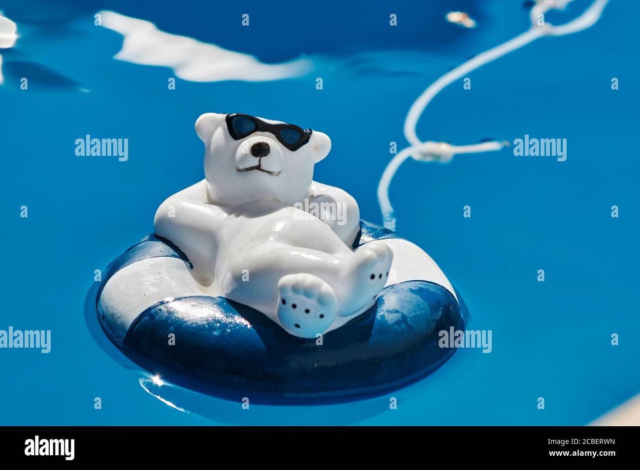 Pool decoration in the form of a relaxed bathing polar bear with ...