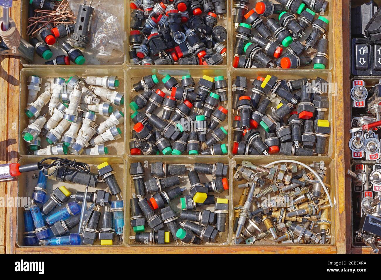 Many push switch spare parts for machines Stock Photo - Alamy