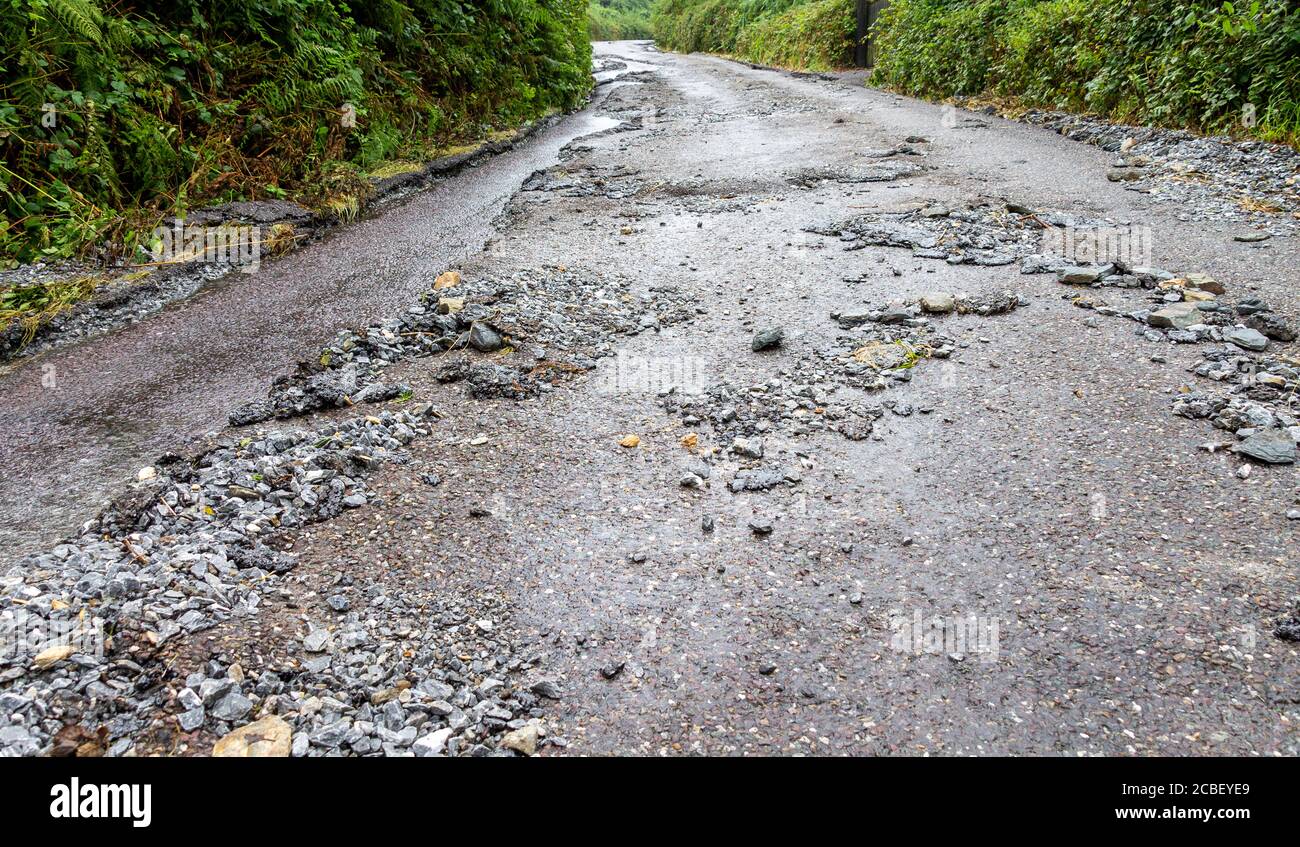 Road Surface damaged and washed away by storm flood waters Stock Photo ...
