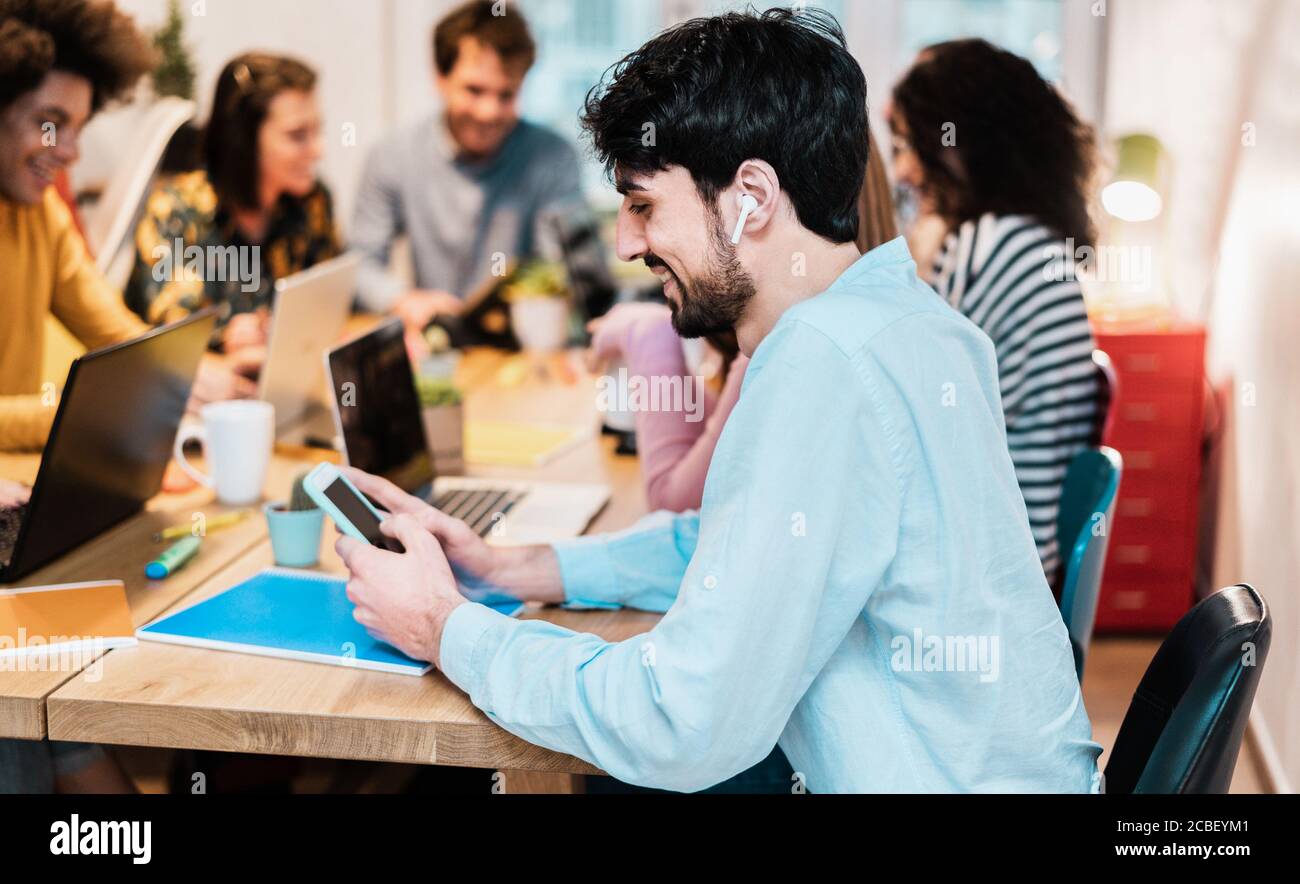 Young co-workers team inside creative office - Happy people planning a ...
