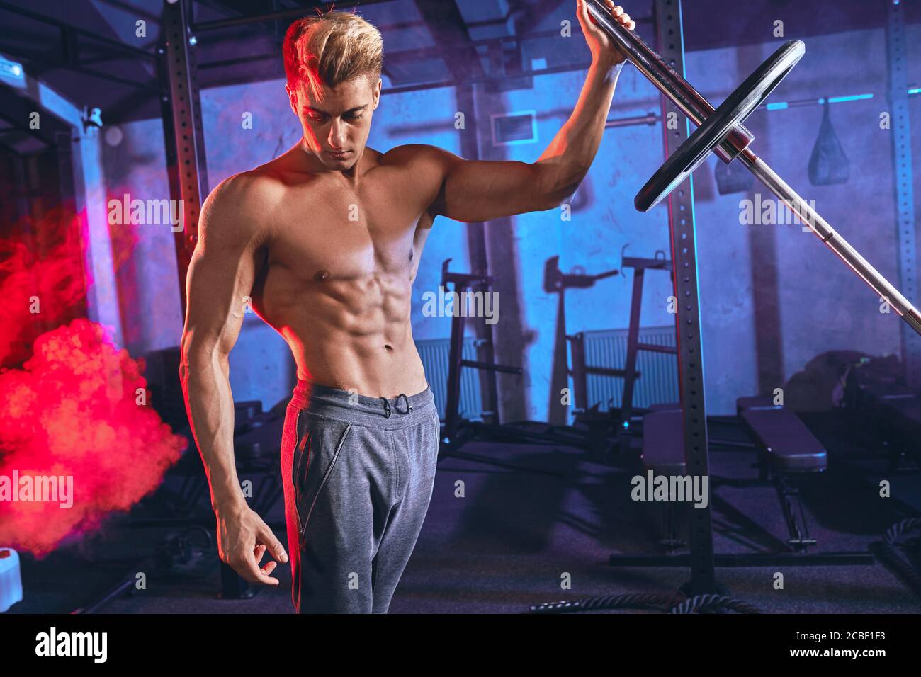 Power athletic male bodybuilder champion doing exercises with heavy ...