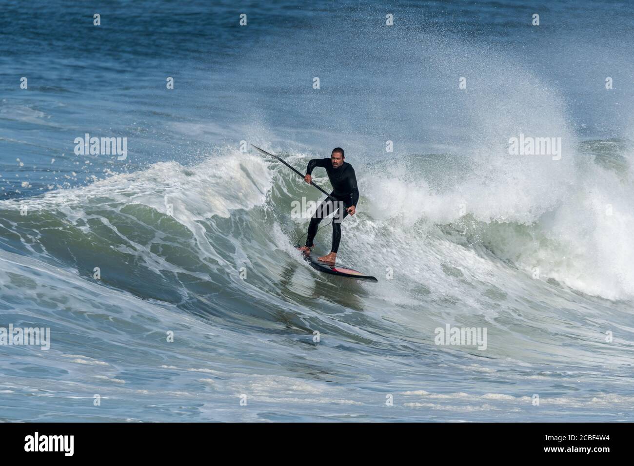 Stand up paddle surfer on the atlantic ocean Stock Photo - Alamy