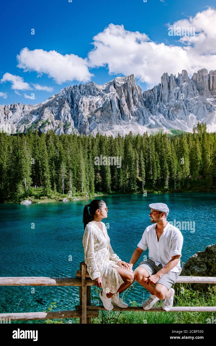 couple visit hte bleu lake in the dolomites Italy, Carezza lake Lago di ...
