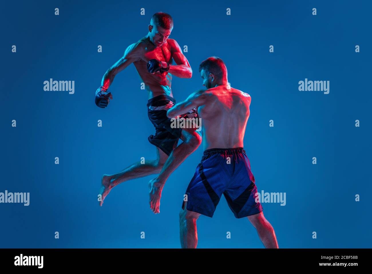 In flight. MMA. Two professional fighters punching or boxing isolated ...
