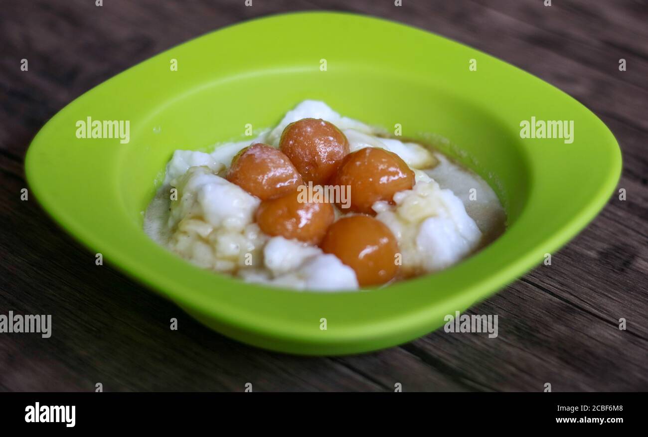 Bubur sum sum on wood background. Bubur sum sum is an Indonesian ...