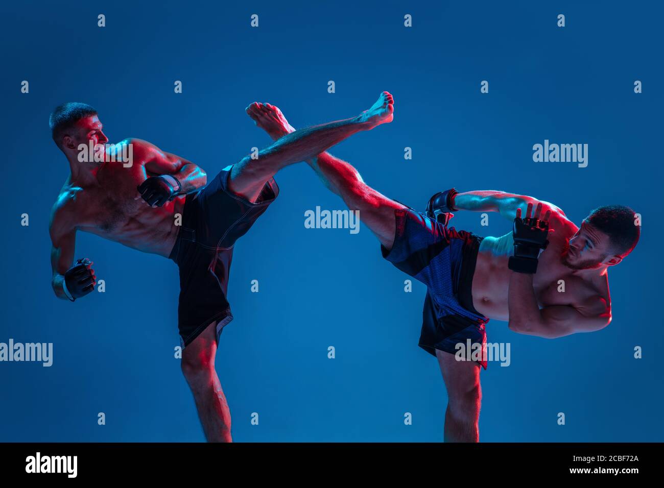 Adrenaline. MMA. Two professional fighters punching or boxing isolated ...