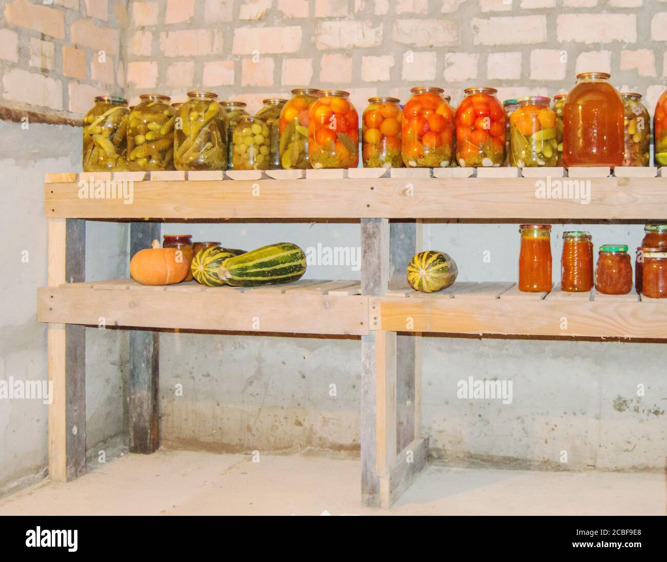 Glass jars for storing food with canned vegetables, fruits and berries ...