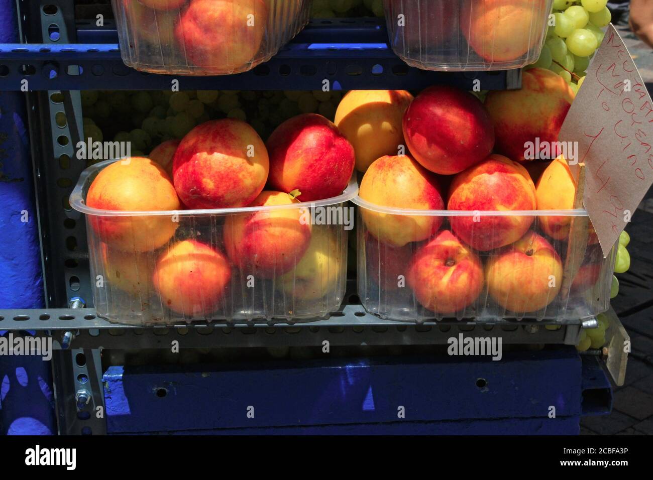 Greece, Athens, August 11 2020 - Stall with peaches in plastic boxes at ...
