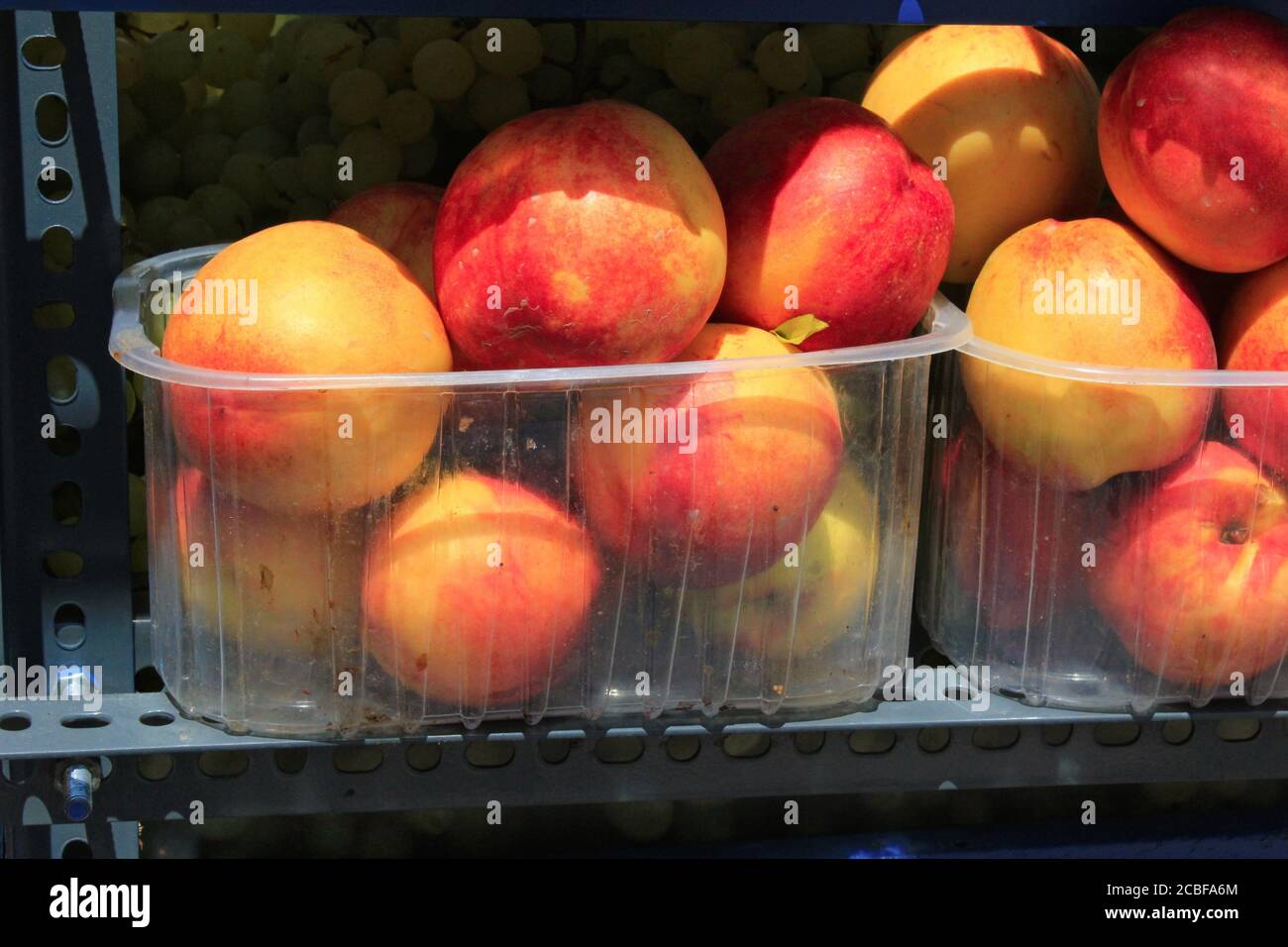 Greece, Athens, August 11 2020 - Stall with peaches in plastic boxes at ...