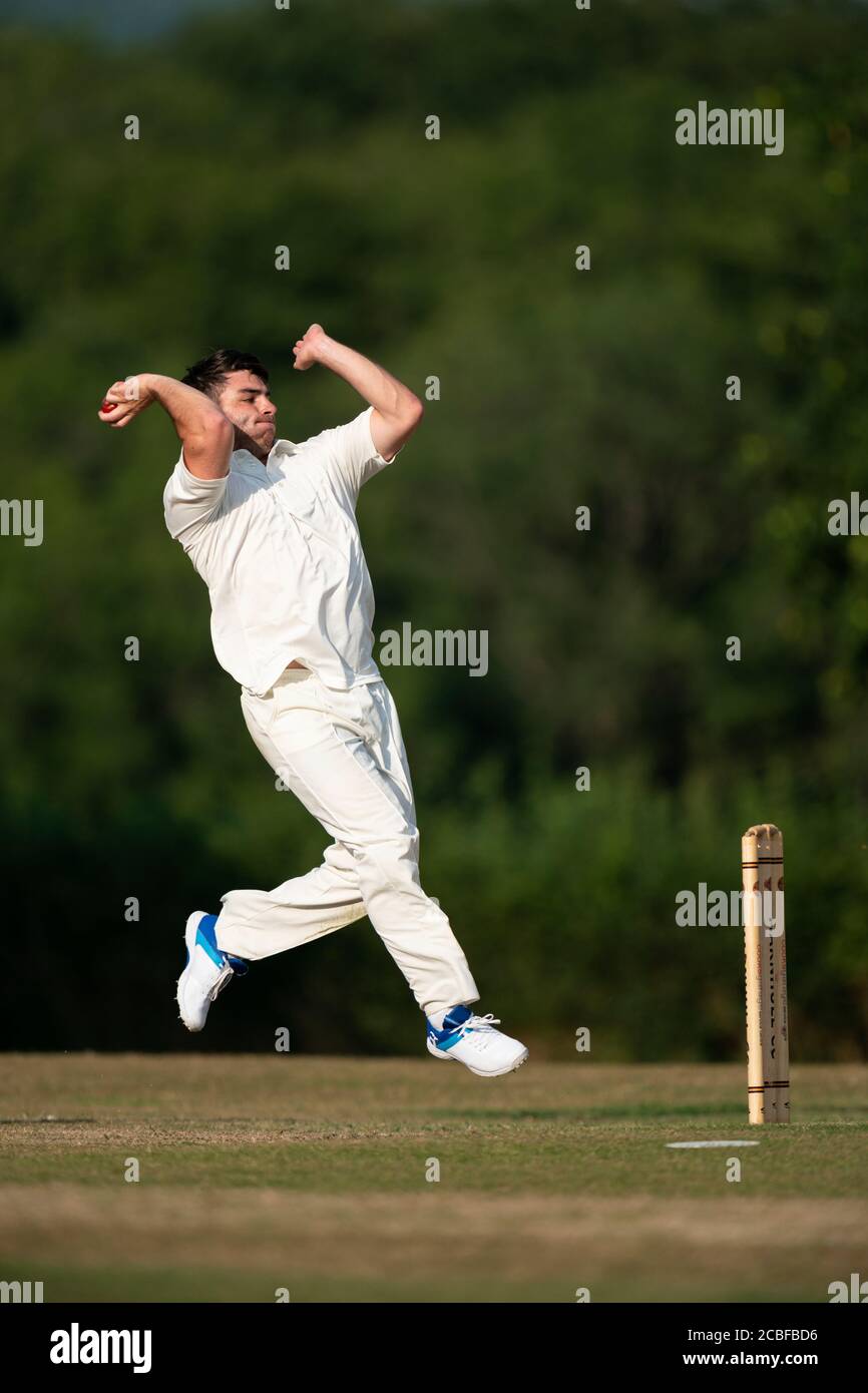 Cricket action bowling jumping hi-res stock photography and images - Alamy