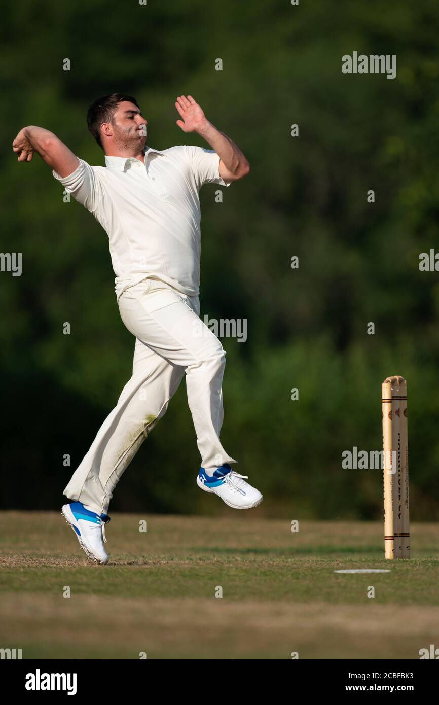 Bowler in action Stock Photo - Alamy