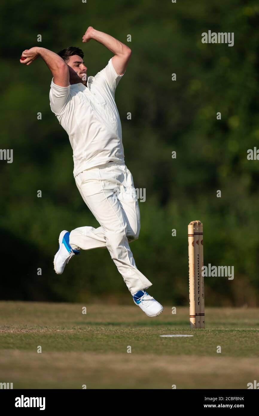 Bowler in action Stock Photo - Alamy