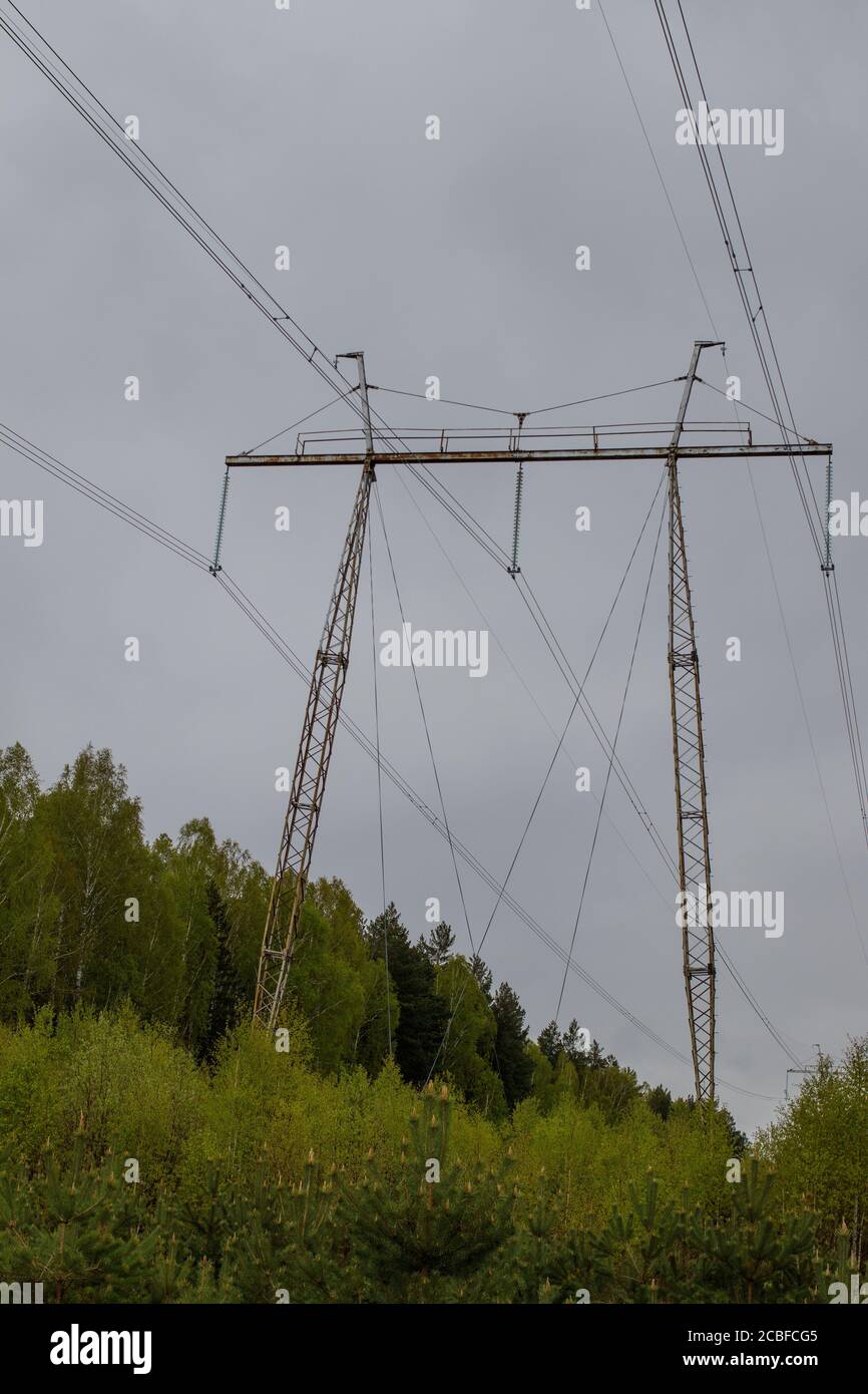 High-voltage power line. Clearing in the mixed Siberian forest, Russia ...